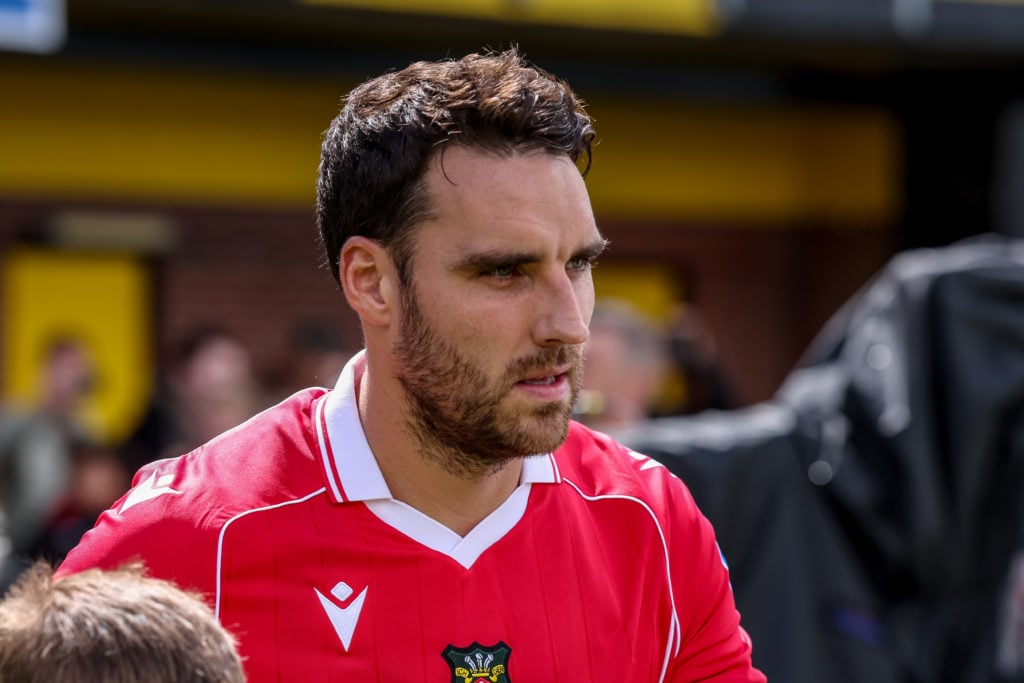 Ball in Phil Parkinson's court as Wrexham star admits he wants to stay ...